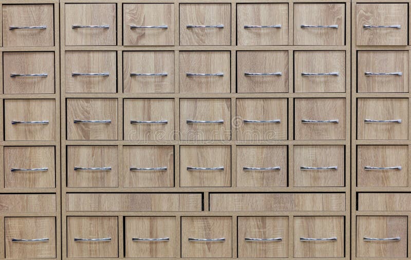 A Row of Wooden Drawers with Silver Handles Stock Image - Image of ...