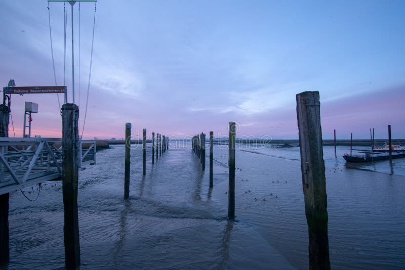 Row of Wooden Posts in the Sea during Twilight Stock Image - Image of ...