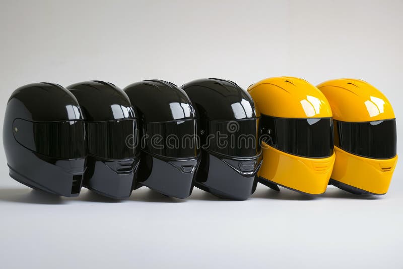 A Row of Yellow and Black Helmets Lined Up in a Row Stock Image - Image ...