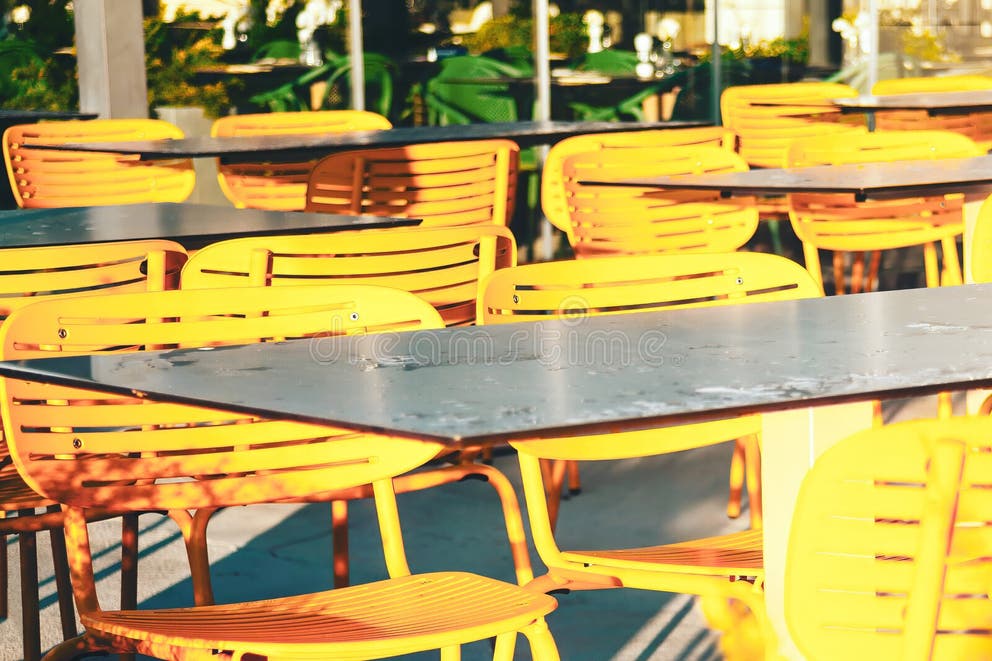 Row of Yellow Chairs are Lined Up in Front of a Table Stock Photo ...
