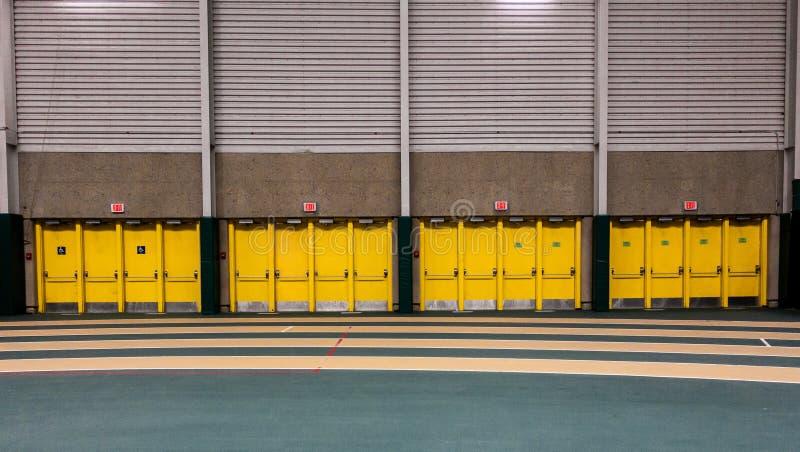 Row of Yellow Doors Inside an Indoor Arena. Stock Image - Image of ...