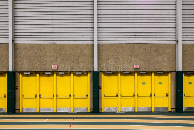 Row of Yellow Doors Inside an Indoor Arena. Stock Image - Image of ...