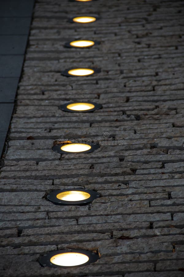 Row of Yellow Lights in a Stone Wall Stock Image - Image of texture ...