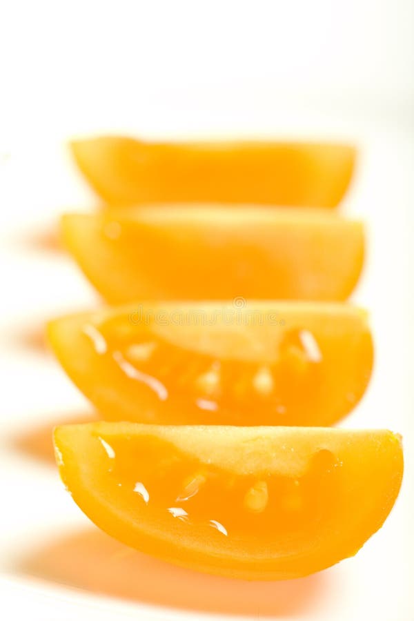 Row of Yellow Tomato Quarters Stock Image - Image of fresh, macro: 6779891