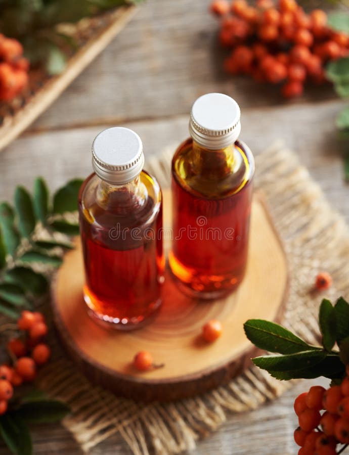 Rowan Berry Syrup in Two Glass Bottles Stock Image - Image of glass ...