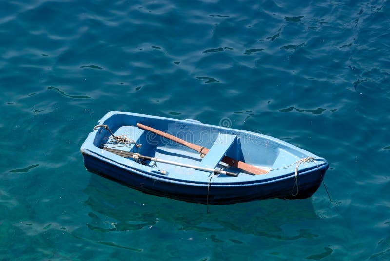 Rowboat stock image. Image of waves, travel, blue, rowboat - 5506835