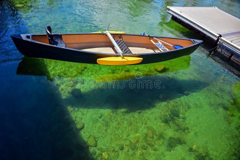 Rowboat on the clear water stock image. Image of outdoor - 48708851