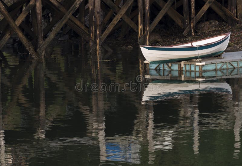 Old rowboat by the dock. stock photo. Image of wood - 101405338