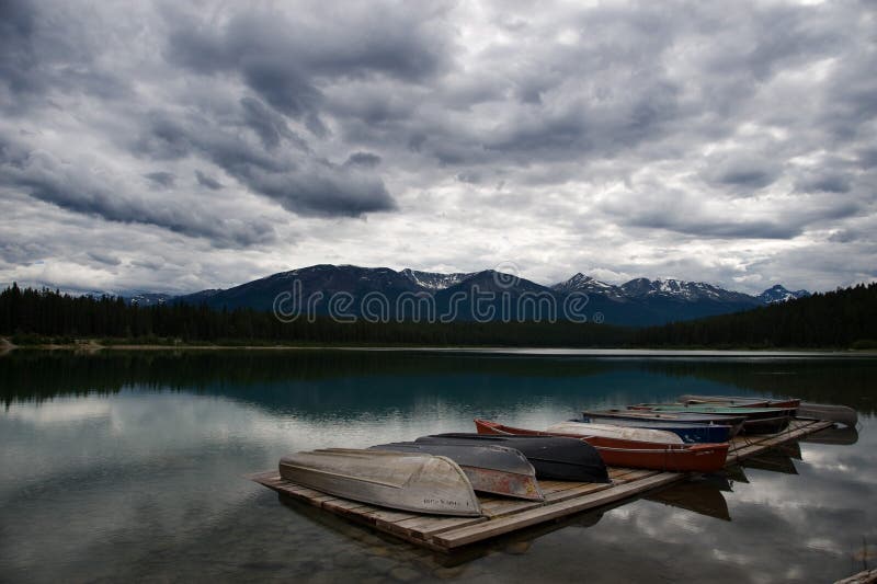 Rowboats in a Lake in Stormy Weather Stock Photo - Image of water, lake ...