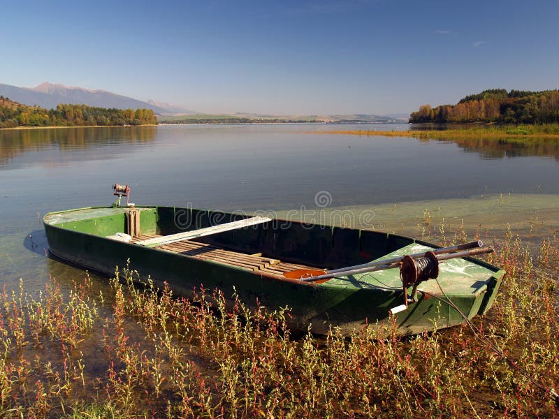 Rowing boat by lake stock image. Image of lake, trees - 3219411