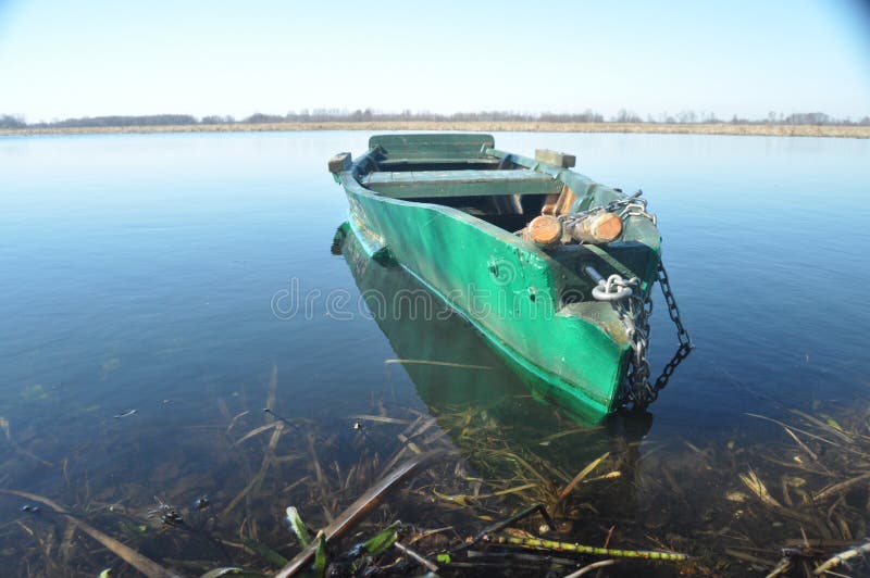 Rowing Boat Moored To the Shore. Spring on the River Stock Image ...