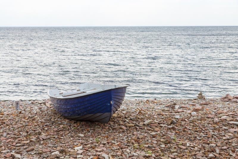 Rowing Boat at a Pebble Beach by the Sea Editorial Stock Photo - Image ...