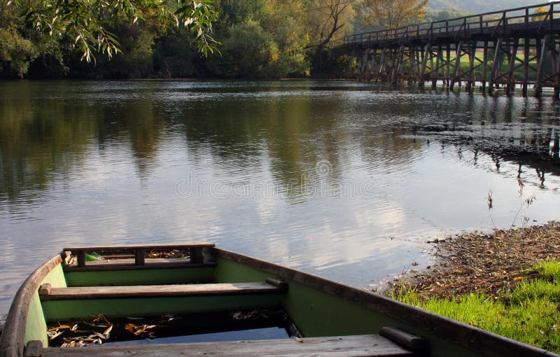 Row boat on the river stock image. Image of reflections - 10862103