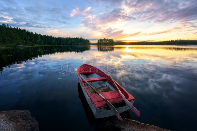 Rowing Boat with Sunset stock image. Image of finland - 61720437