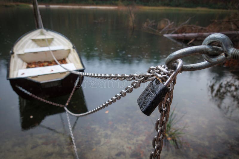 Rowing Boats are Secured with a Chain and a Padlock Stock Photo - Image ...