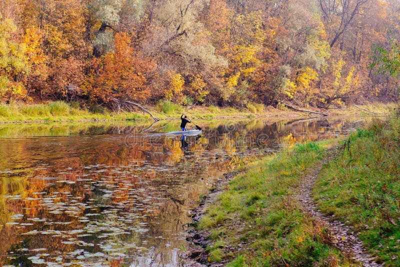 Rowing and Canoe Float Down the River in Autumn Stock Photo - Image of ...