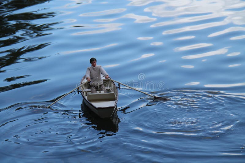 Rowing a Small Boat. stock image. Image of boating, radio - 361545547