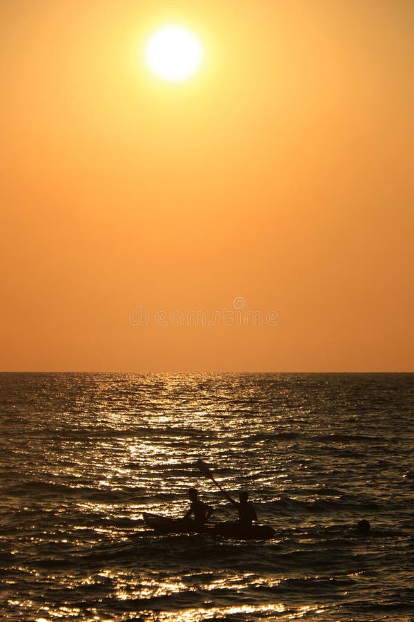 Rowing into Sunset stock photo. Image of nature, activity - 164886560