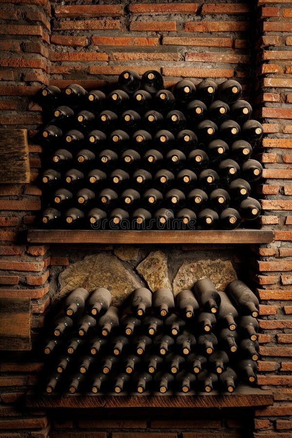 Rows of Aged Wine Bottles in a Rustic Cellar Stock Photo - Image of ...