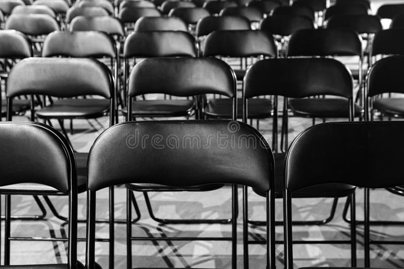 Rows of Black Empty Chairs in Entertainment Hall Stock Photo - Image of ...