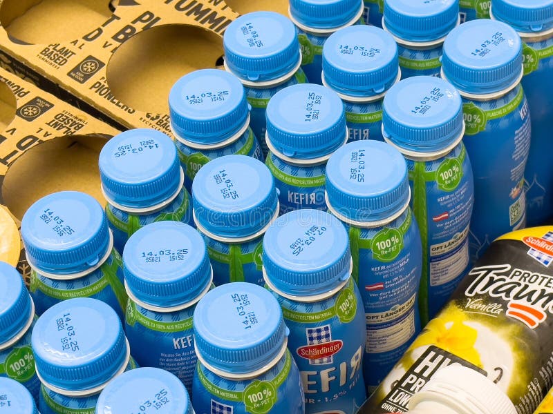Rows of Blue-lid Kefir Bottles in Store Display Editorial Photography ...