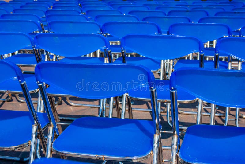 Rows of Blue Seats in the Park with Chairs Set Aside for the Concert ...
