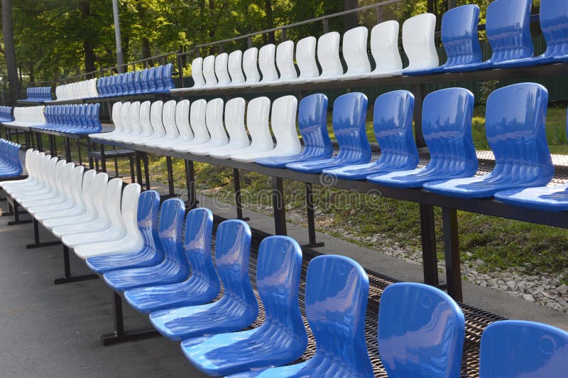 Rows of Blue and White Plastic Seats in the Stands of a Sports Stadium ...