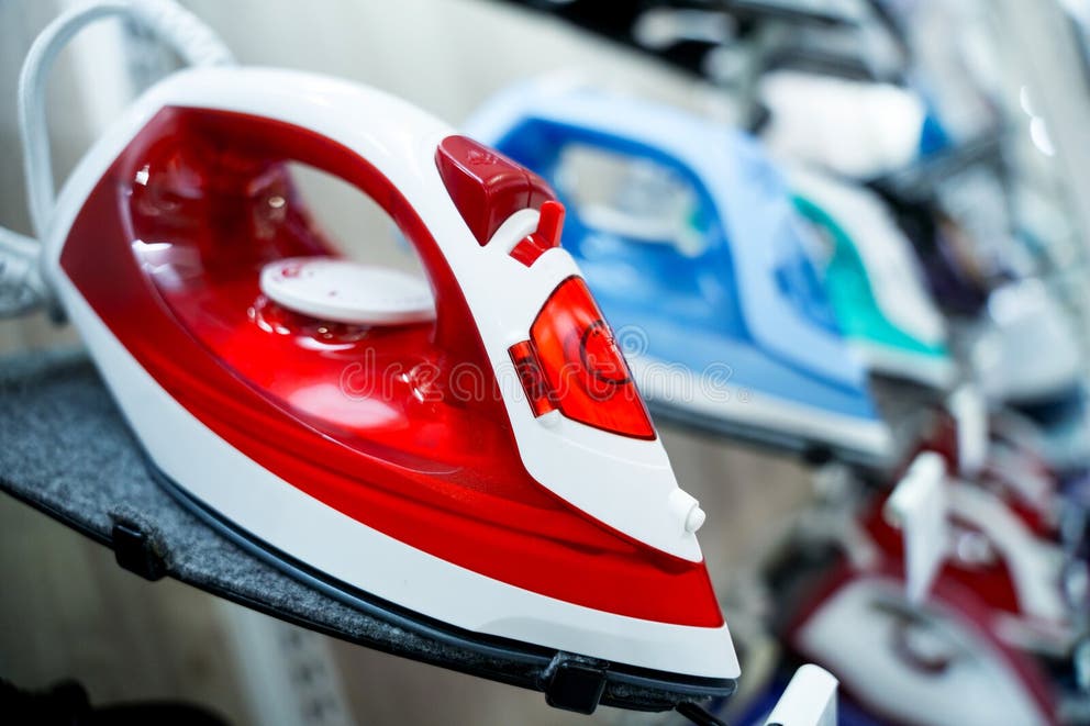 Rows of Colored Electric Irons at the Showroom of a Large Store Stock ...