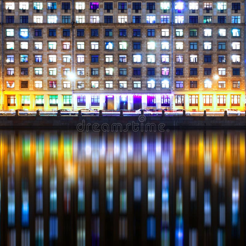 A Night View of Windows of a Multifamily House with Reflections on ...