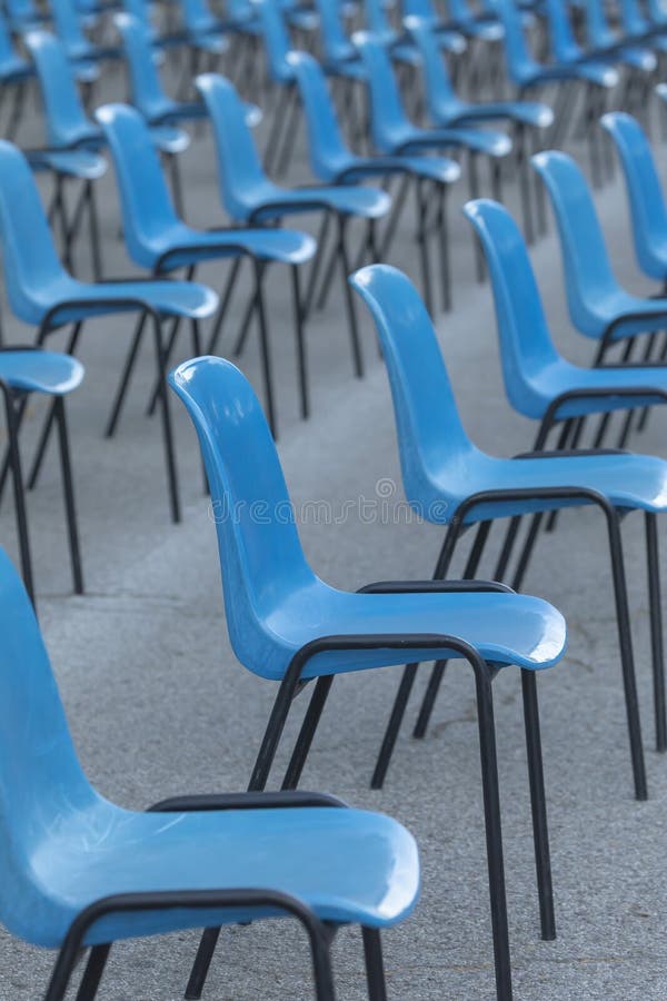Rows and Columns of Nondescript Blue Plastic Chairs, Spain Stock Photo ...
