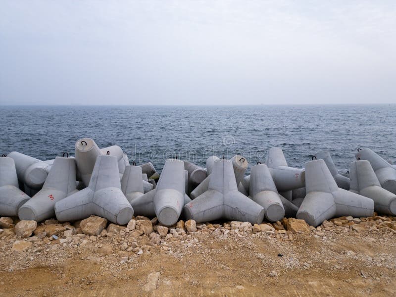Rows of Concrete Blocks Along Beach Stock Photo - Image of coastal ...