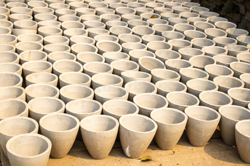 Rows of Concrete Pots Stacked for Drying in the Morning Sunlight Stock ...