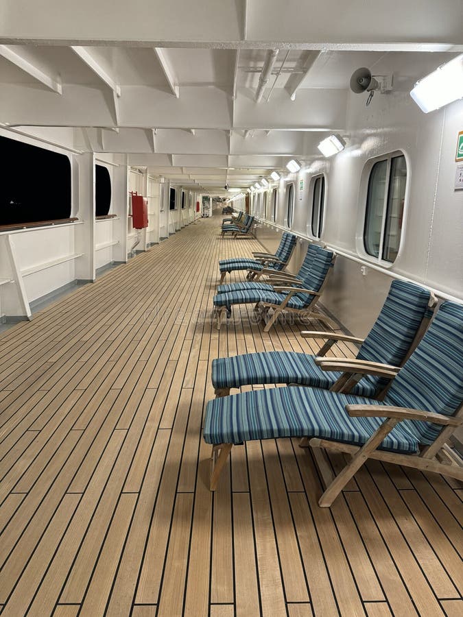 Rows of Deck Chairs on a Cruise Ship Deck with Windows Behind Them ...