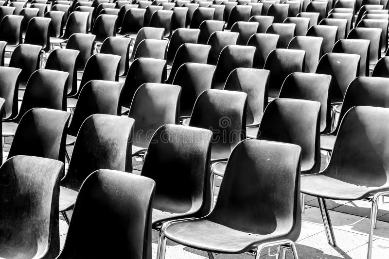 Rows of empty black chairs stock image. Image of european - 175879153