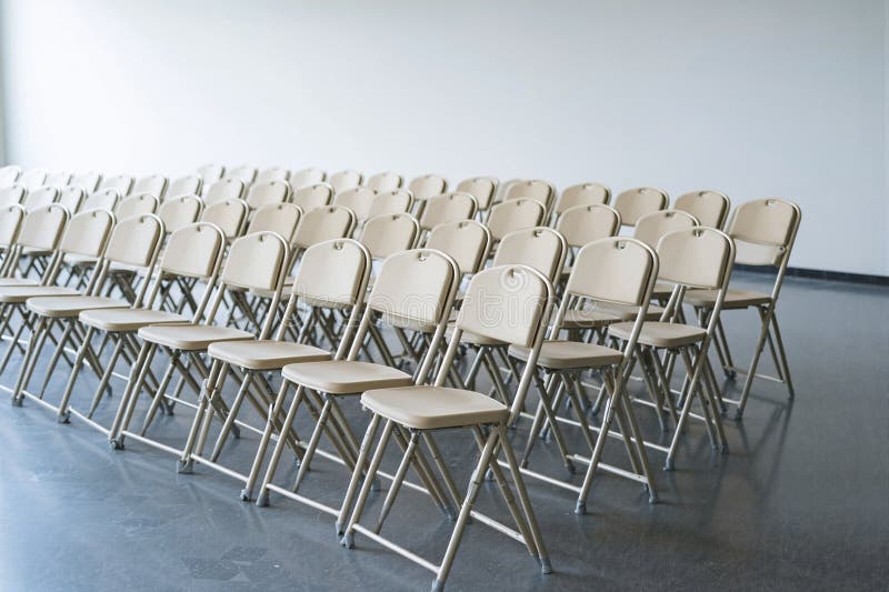 Rows of Empty Folding Chairs Preparing for a Conference Stock Image ...
