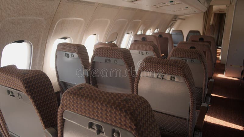 Empty Airplane Cabin Interior Showing Rows of Seats and Windows in a ...