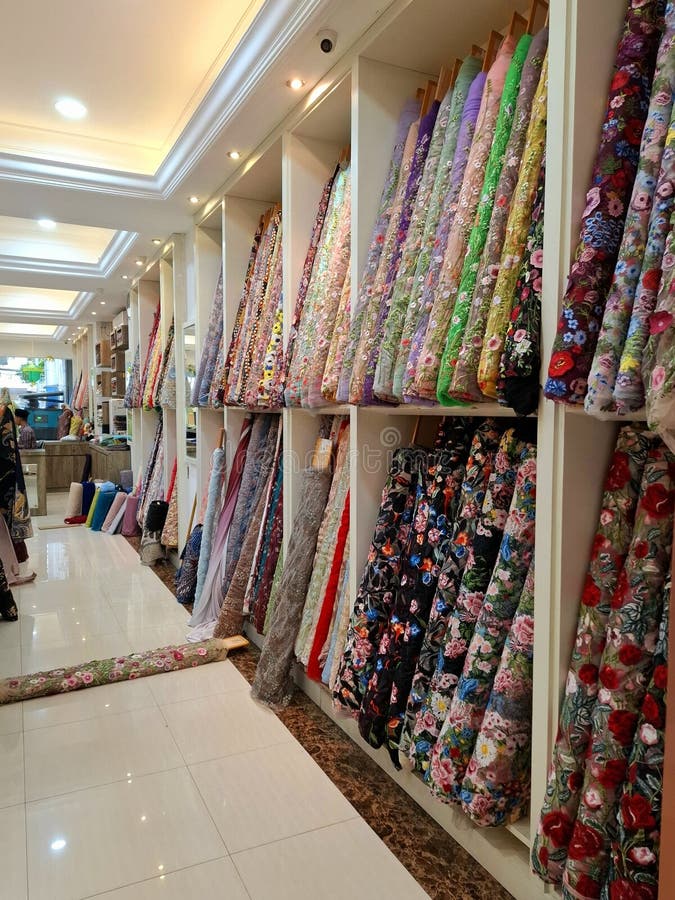 Rows of Fabric Rolls are Displayed on Shelves in a Fabric Store. Editorial Stock Photo - Image ...