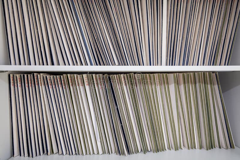 Rows of File Folders Arranged on Shelf with Client Data in Office ...