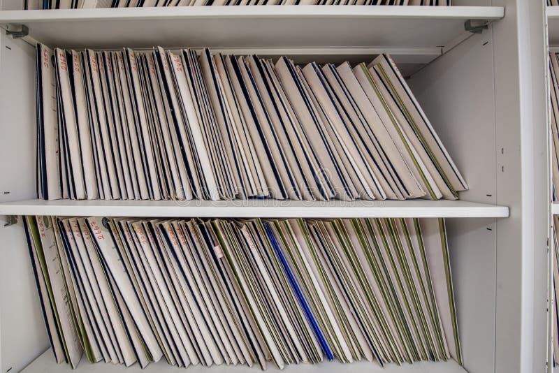 Rows of File Folders Arranged on Shelf with Client Data in Office ...