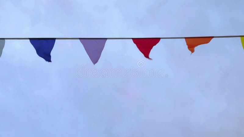 Rows of Fluttering Triangular Flags in a Stormy Weather. Concept of ...