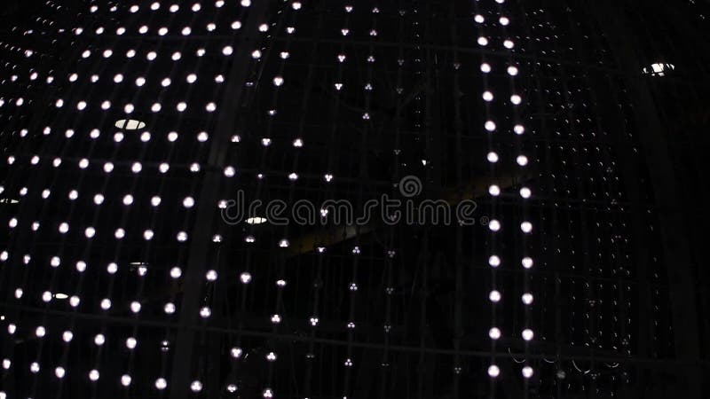 Rows of Glowing Lights on a Black Background Moving in a Circle. Moving ...