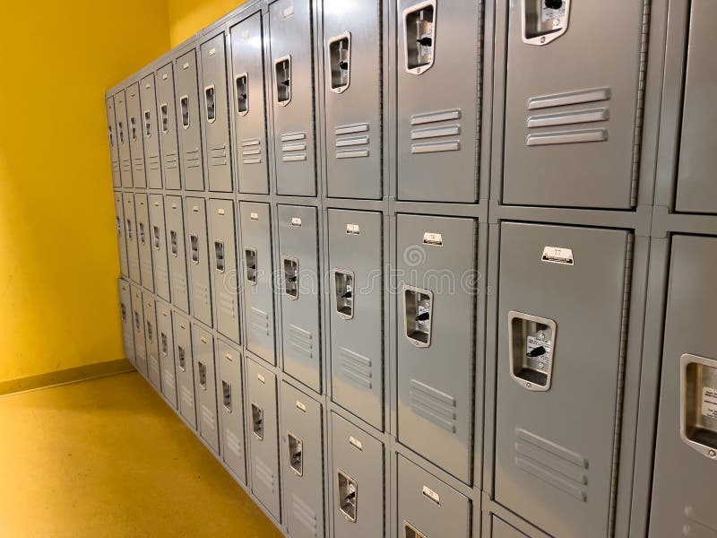 Rows of Gray School Lockers Lined Up Against a Yellow Wall Stock Image ...