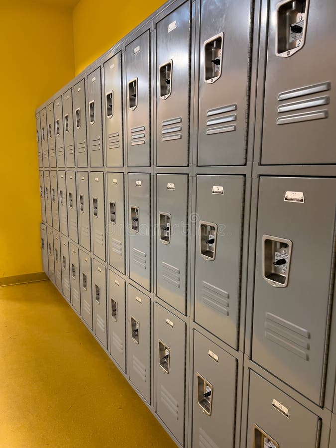 Rows of Gray School Lockers Lined Up Against a Yellow Wall Stock Image ...