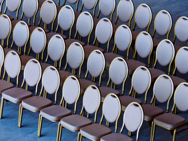 Order and Symmetry: Rows of Chairs Stock Photo - Image of brown, gold ...
