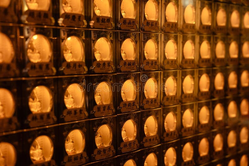 Rows of Illuminated Golden Plaques with Names in a Dimly Lit Interior ...
