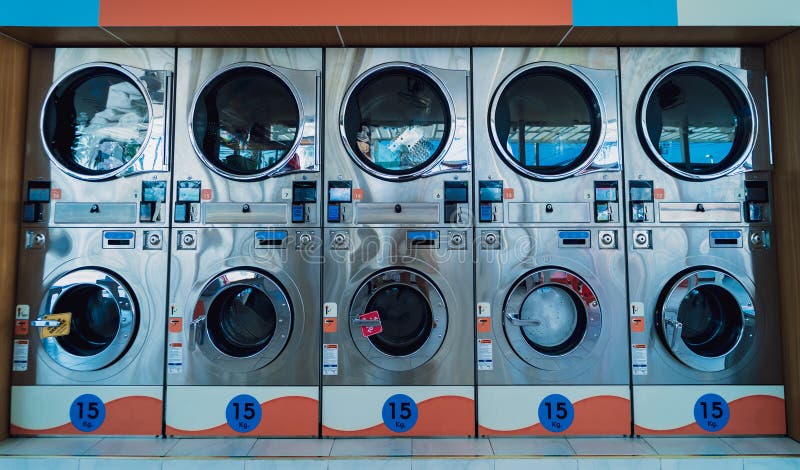 Rows of Industrial Laundry Machines in the Large Laundromat. Stock ...