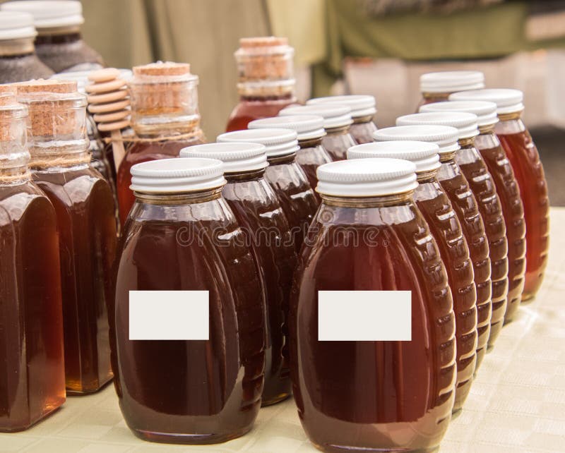 Rows of Jars with Amber Colored Honey. Stock Image - Image of ...