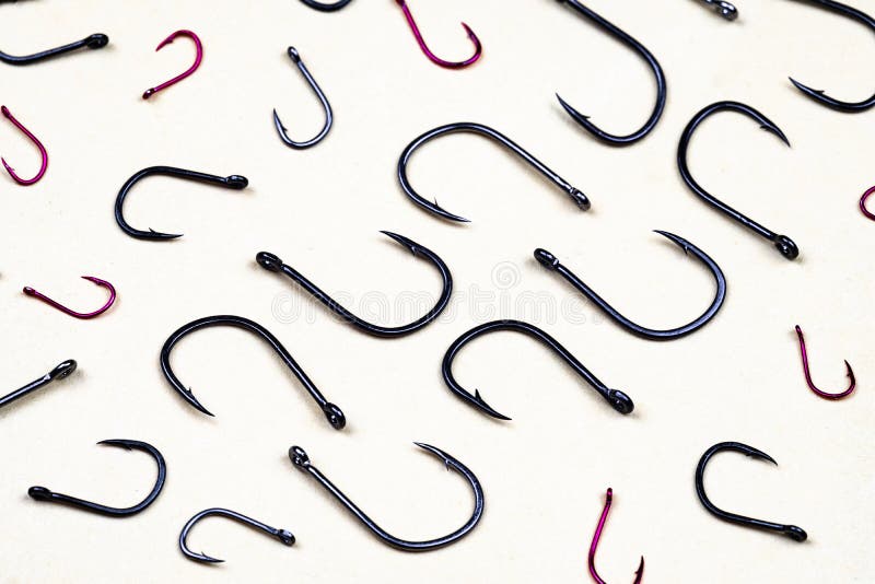 Rows of Large and Small Fishing Hooks of Different Colors Stock Photo ...