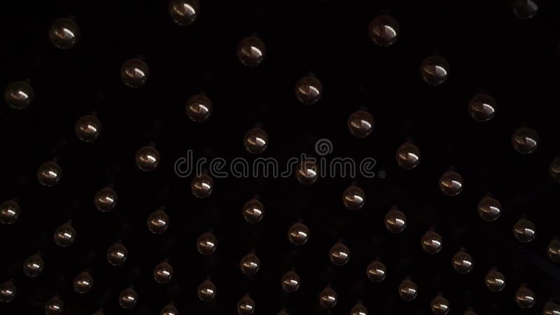 Rows of Light Bulbs Flashing on a Metal Panel. Glowing Warm Light ...