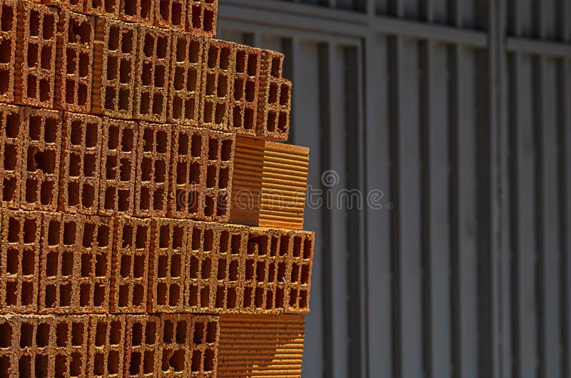 Rows of New Red Mud Bricks with Internal Cavities To Lighten, Increase ...